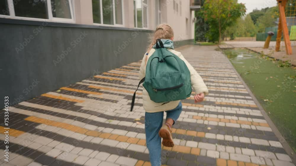 Back view little girl run quickly elementary primary school schoolgirl ...