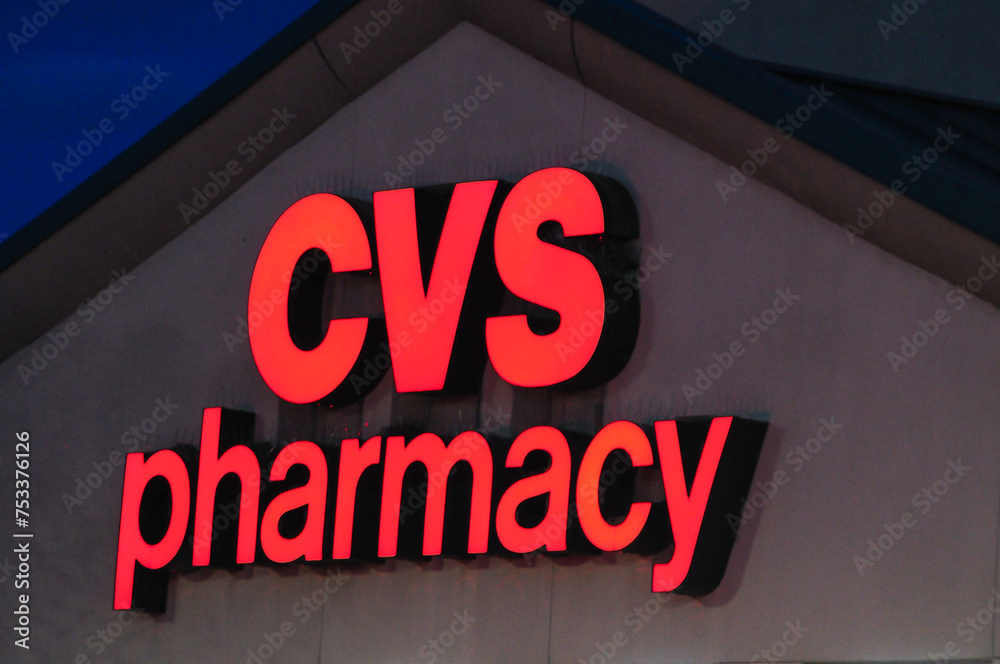 The exterior of a CVS Pharmacy building displays its bright red ...