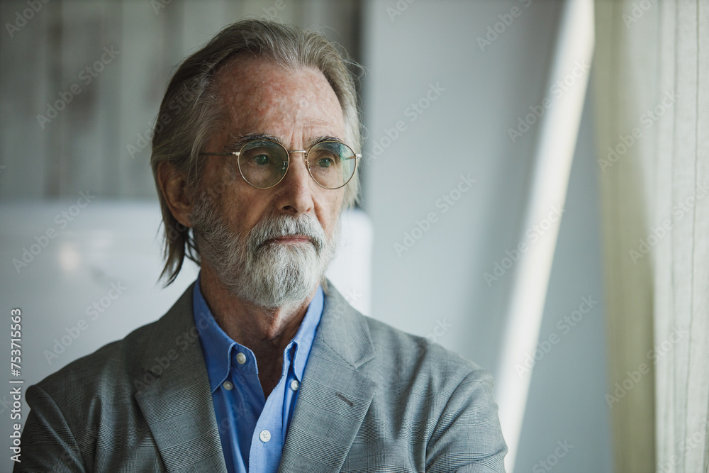 Portrait of senior handsome man wear eyeglasses with grey hair and ...