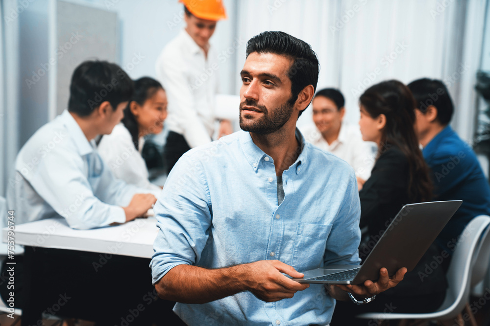 Engineer team leader portrait with diverse group of civil engineer and ...