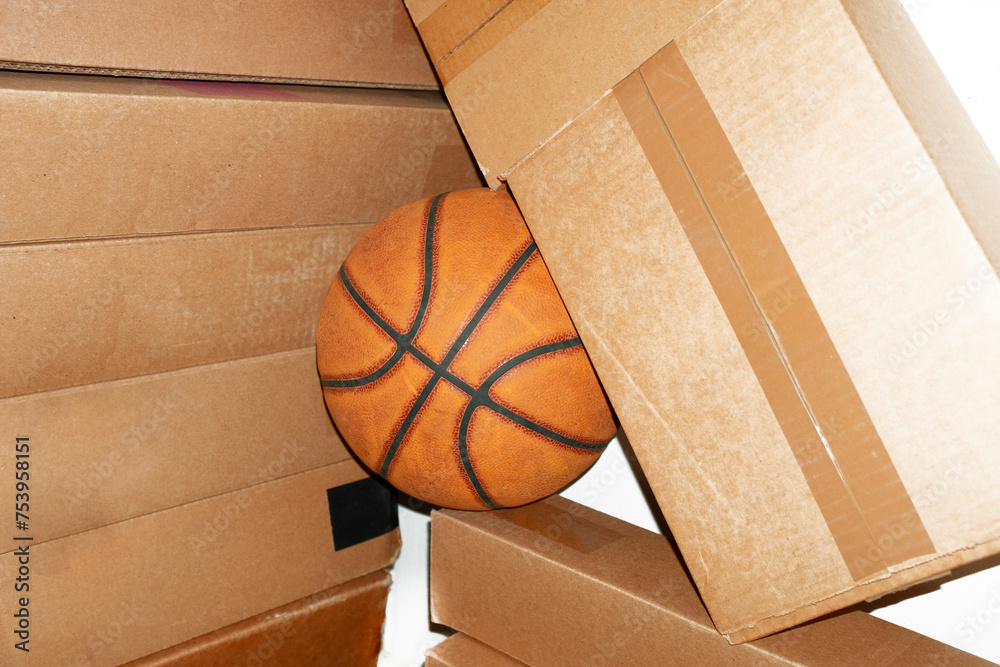 Contemporary style photo of basketball cardboard boxes and flashlight ...