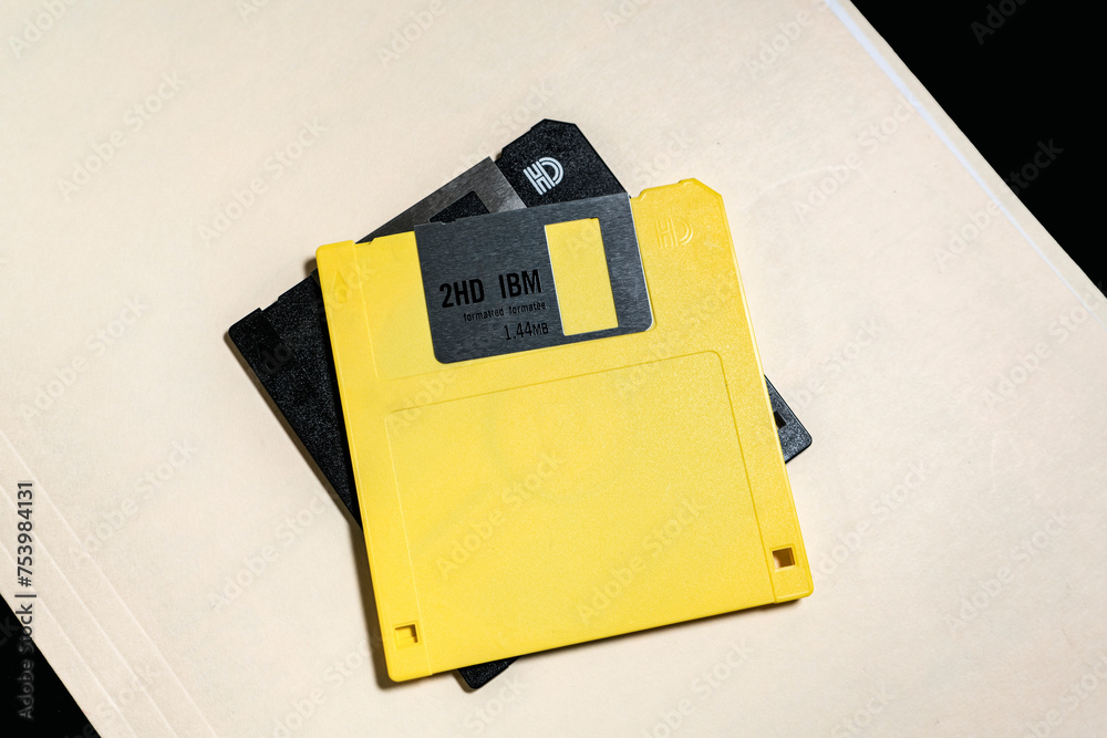 Old 3 and a half inch floppy disks on a manila folder Stock Photo ...
