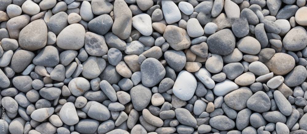 A group of gray gravel stones tightly packed next to each other ...