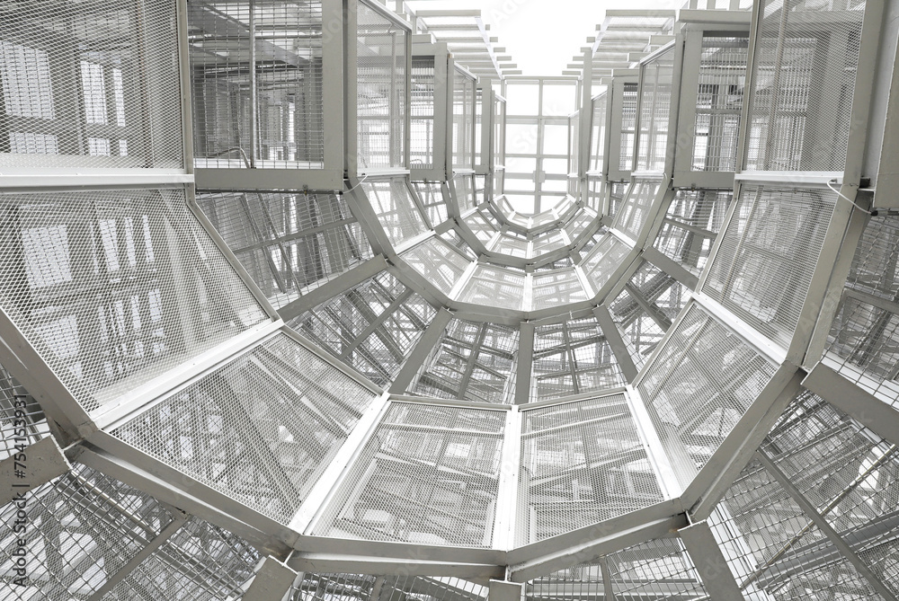 White steel frame structure with surrounding walls are lined with steel ...