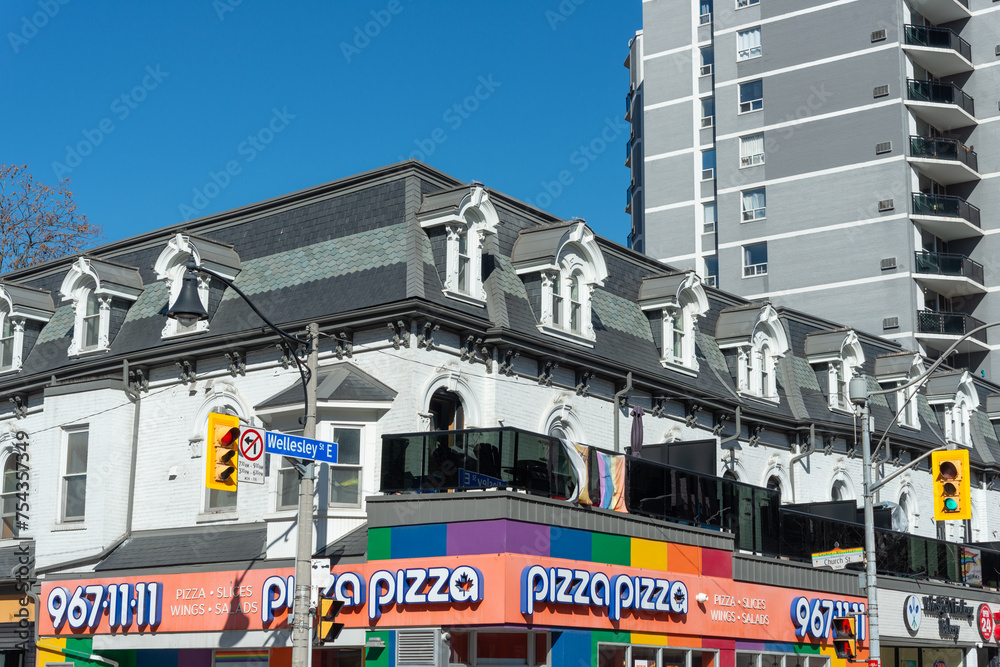 exterior building facade and sign for pizza pizza, a pizza restaurant ...