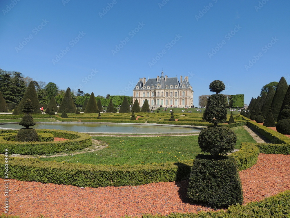 Elegant Sceaux Park: French Chateau and Formal Gardens Under Clear Blue ...