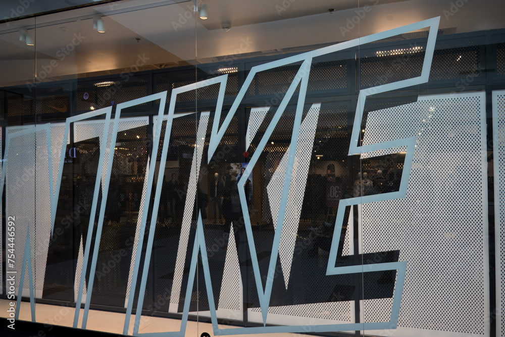Nike logo. Nike is a global sports clothes and running shoes retailer ...