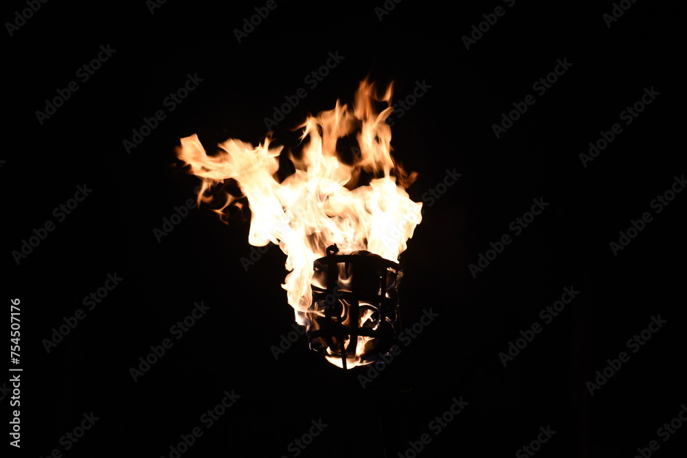 Flames of a coppara torch that lighting in Kandy Esala Perahera at ...