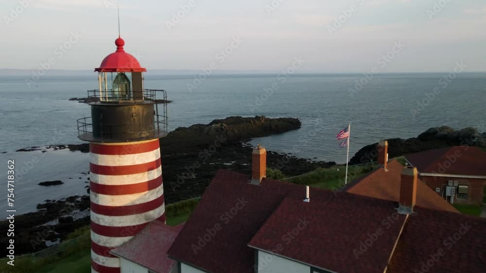Drone footage captures a breathtaking aerial view of a lighthouse at ...