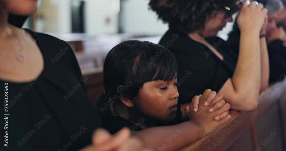 Child, praying and family in church with religion, memorial or funeral ...