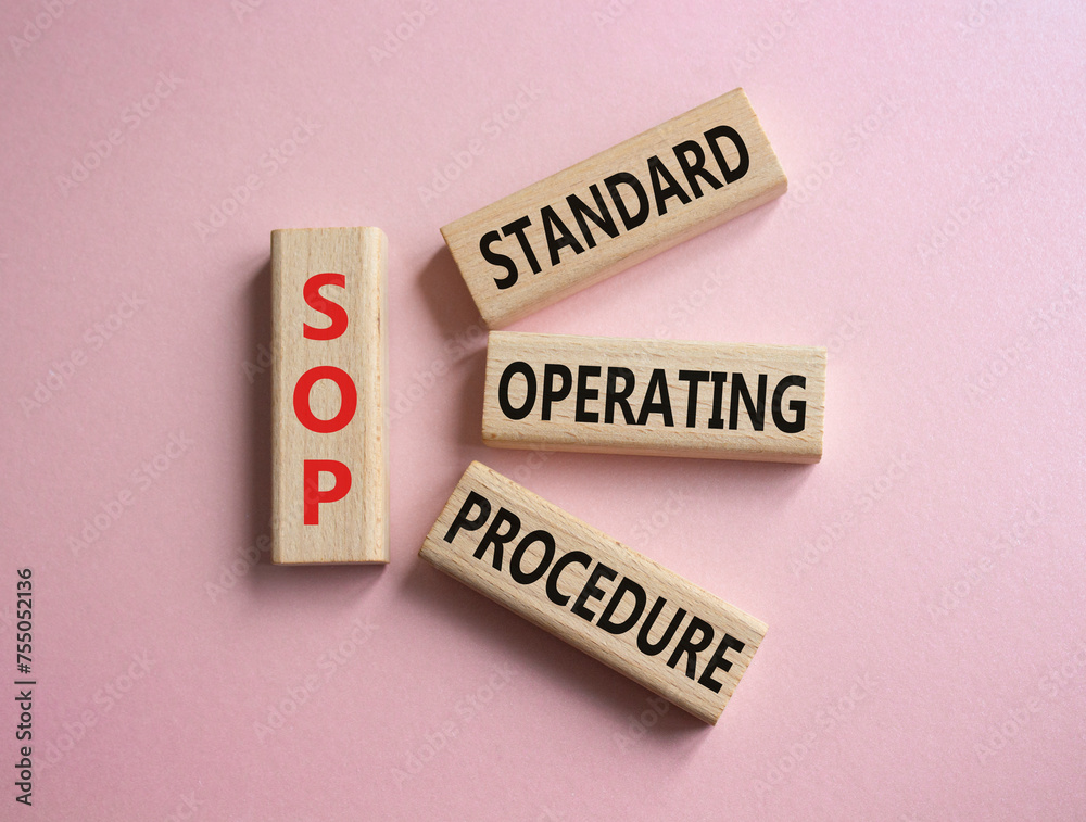 SOP - Standard Operating Procedure symbol. Wooden blocks with word SOP ...