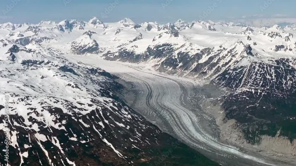 Glacier seen from small airplane in Lake Clark Pass, Alaska. Dark ...