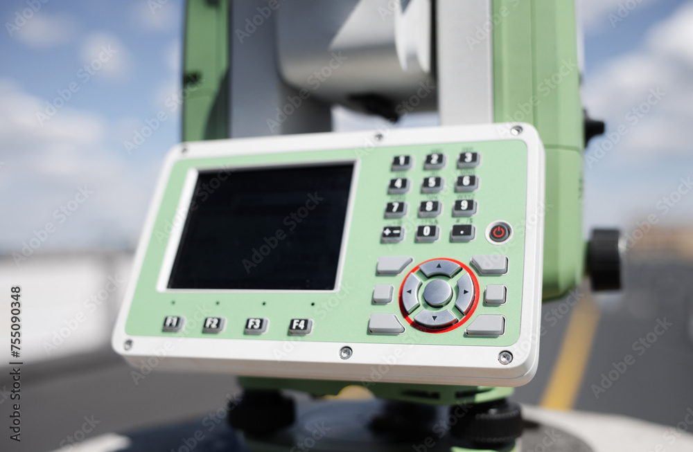 Total station against a background of blue sky close up. Geodetic ...