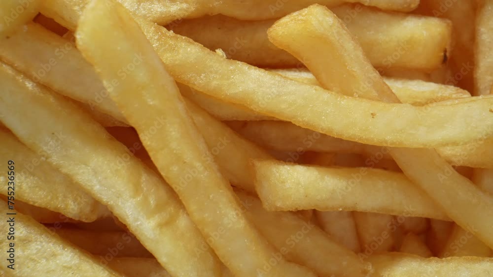 Crispy golden French fries, a beloved classic, are thinly cut potatoes ...