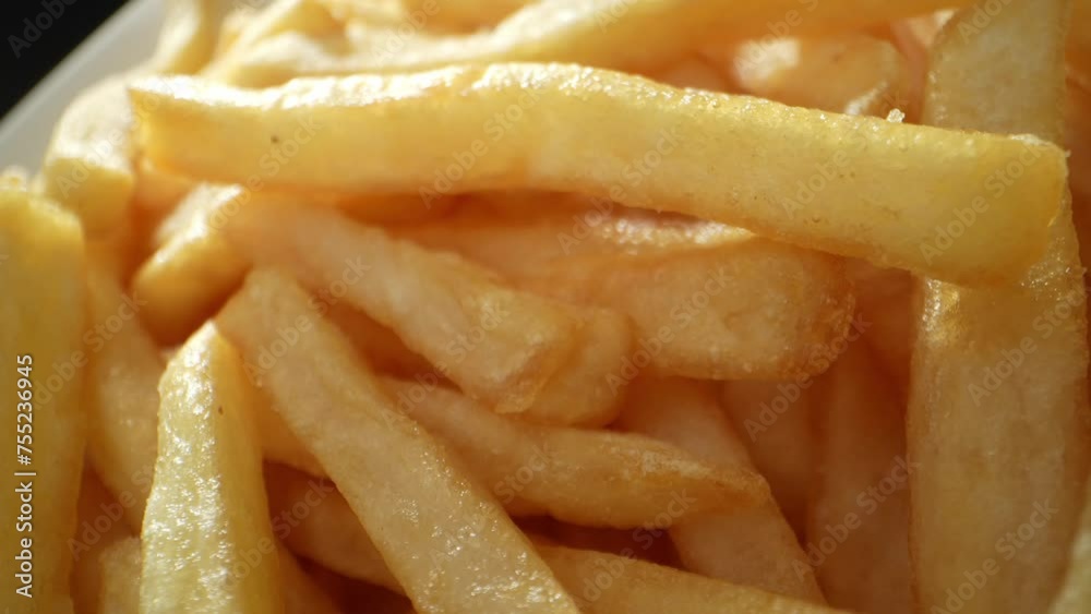 French fries, a beloved staple of fast food culture, are thinly cut ...