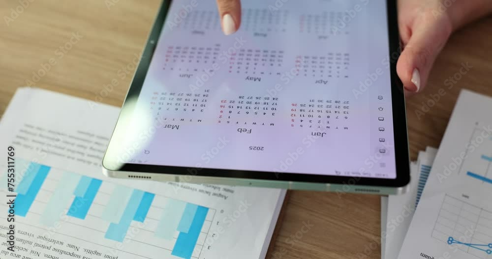 Woman reviews calendar to check appointments using tablet Stock Video ...