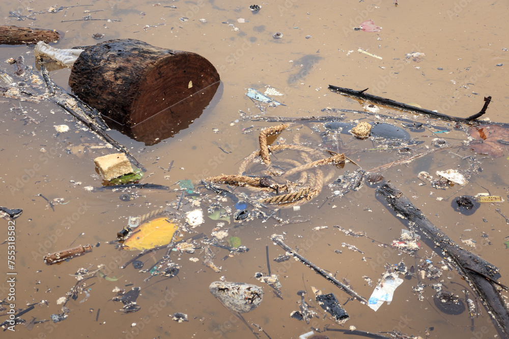 garbage floating in sea water by beach, dirty sea pollution, waste on ...
