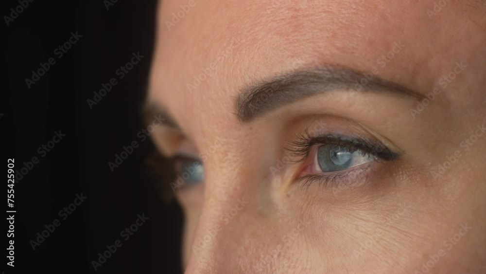 Intermittent flashes of police siren and strobe light on female face ...