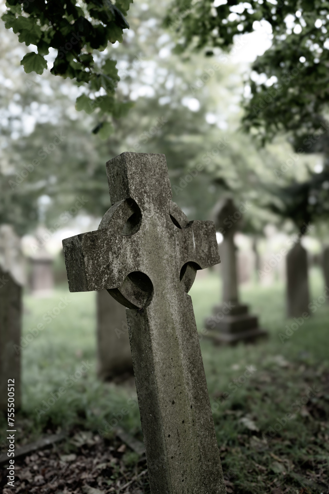 Vertical aspect of a leaning stone gravestone seen in an English ...