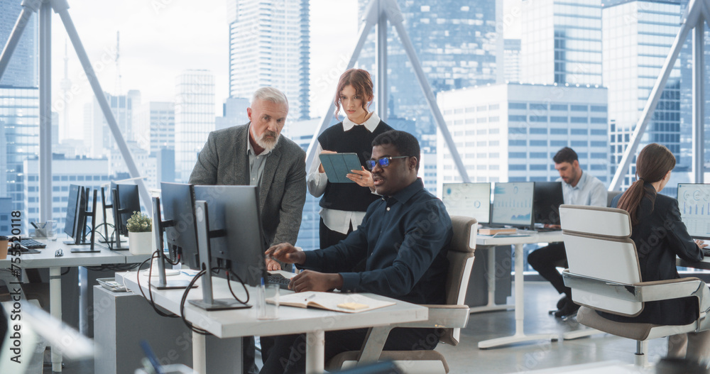 Diverse Colleagues Talking In Front Of Desktop Computer In Corporate ...