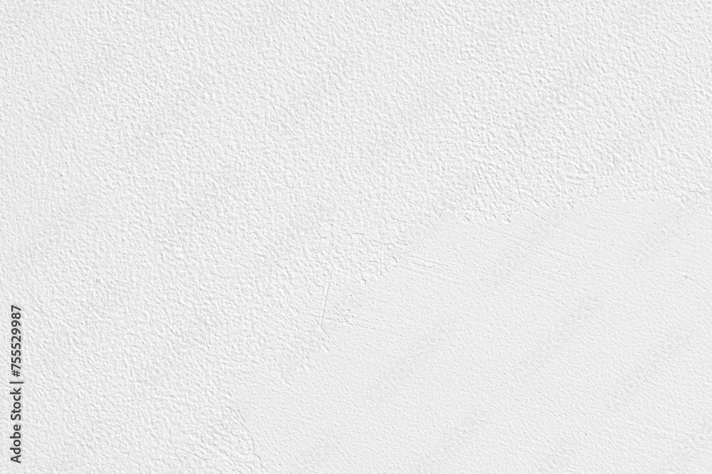 White painted concrete wall with filler paste repair. Uneven filler on ...