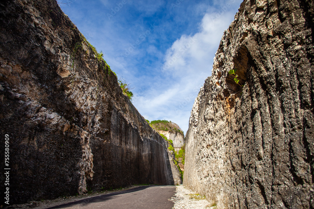 Road and limestone cliffs leading to Melasti Beach in Bali, Indonesia ...