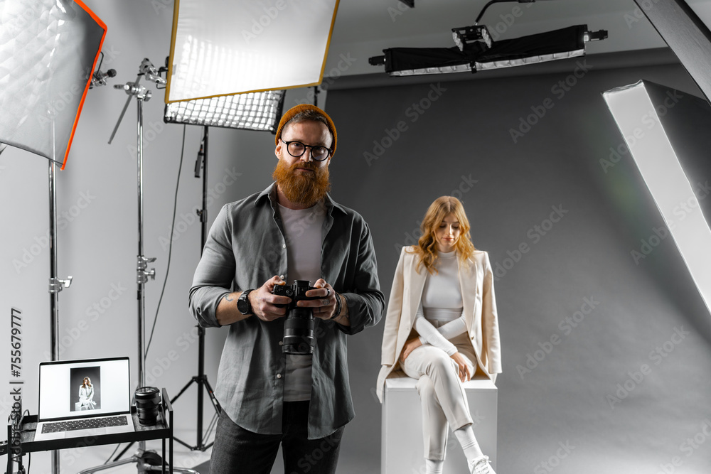 Photographer and fashion model in studio for creative art, clothes ...