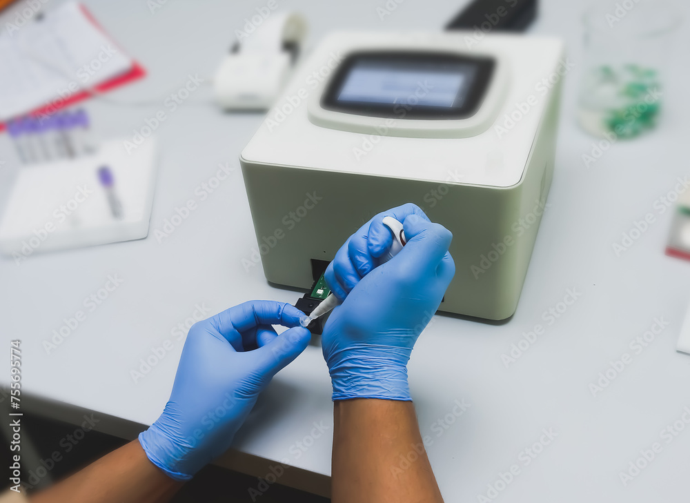 Scientist pipetting sample for PCR test at PCR machine. pipette into ...