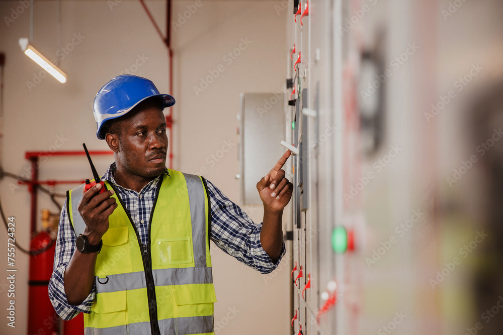 Electrical engineer working in control room. Electrical engineer man ...