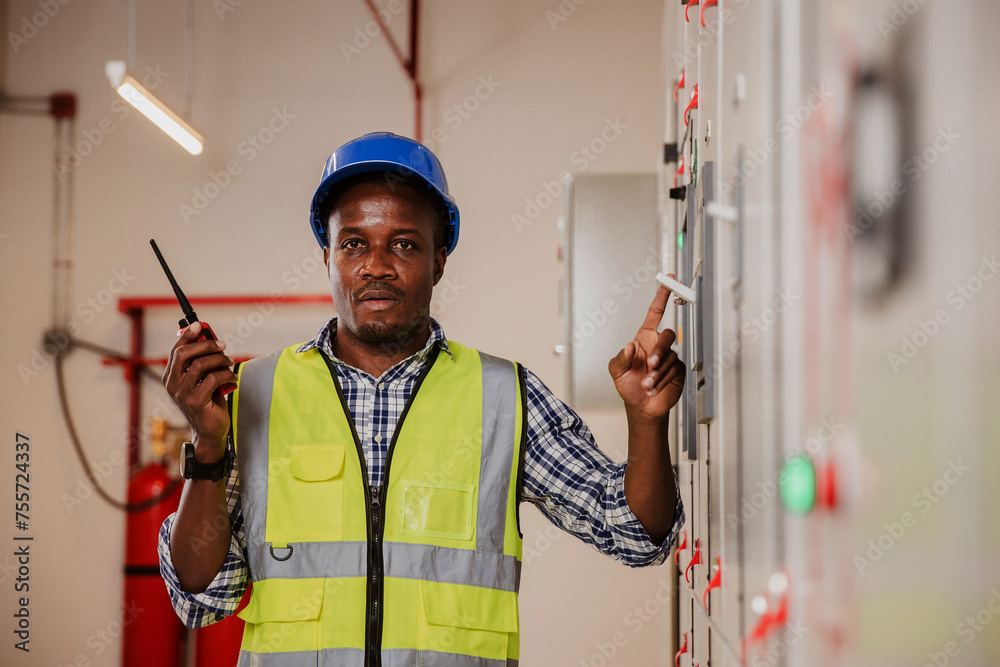 Electrical engineer working in control room. Electrical engineer man ...