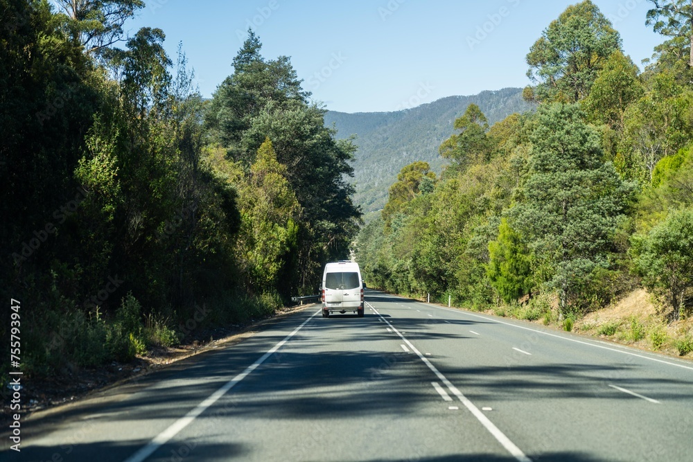 tourist traveling in a caravan exploring nature driving on a raod in ...