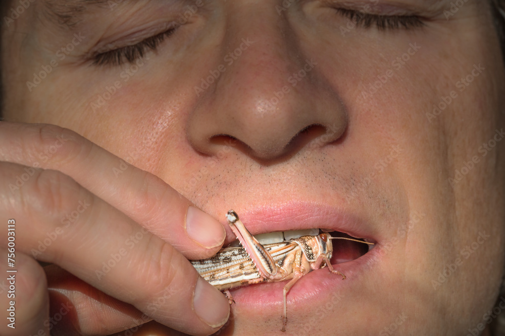 Hungry man eating insects as new food lifestyle and alternative protein ...