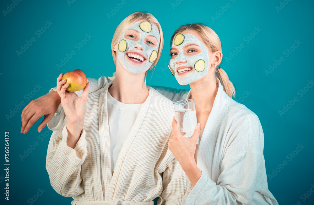 Girls friends sisters making clay facial mask. Anti age mask. Stay ...