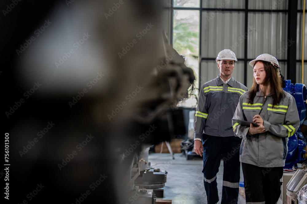 engineers check control heavy machine robot arm. Diverse Team of ...