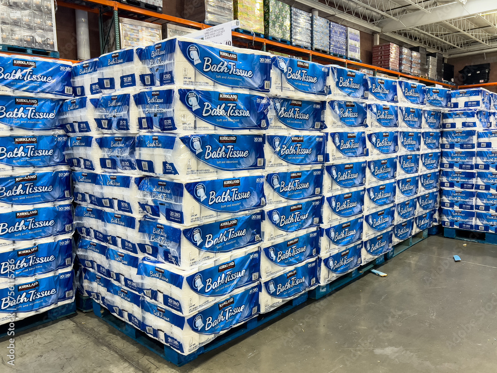 Pallets of big plastic bags containing Kirkland signature brand wide ...