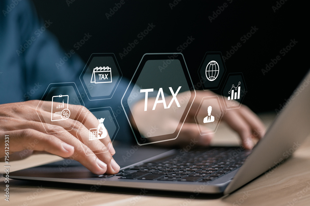 E-tax concept. Person use laptop to calculate income to pay taxes to ...