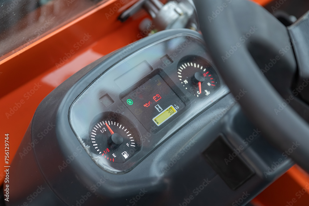 Novosibirsk, Russia - February 29 , 2024: Orange tractor, cockpit ...