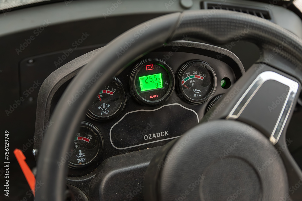 Novosibirsk, Russia - February 29 , 2024: Orange tractor, cockpit ...