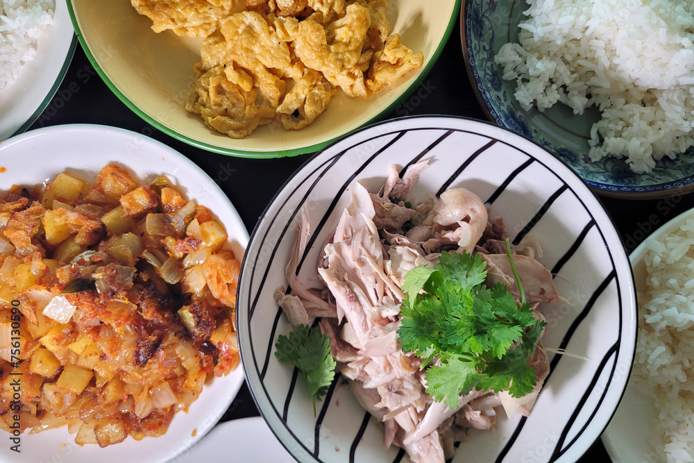 The top view displays a spread of home-cooked Chinese food ...