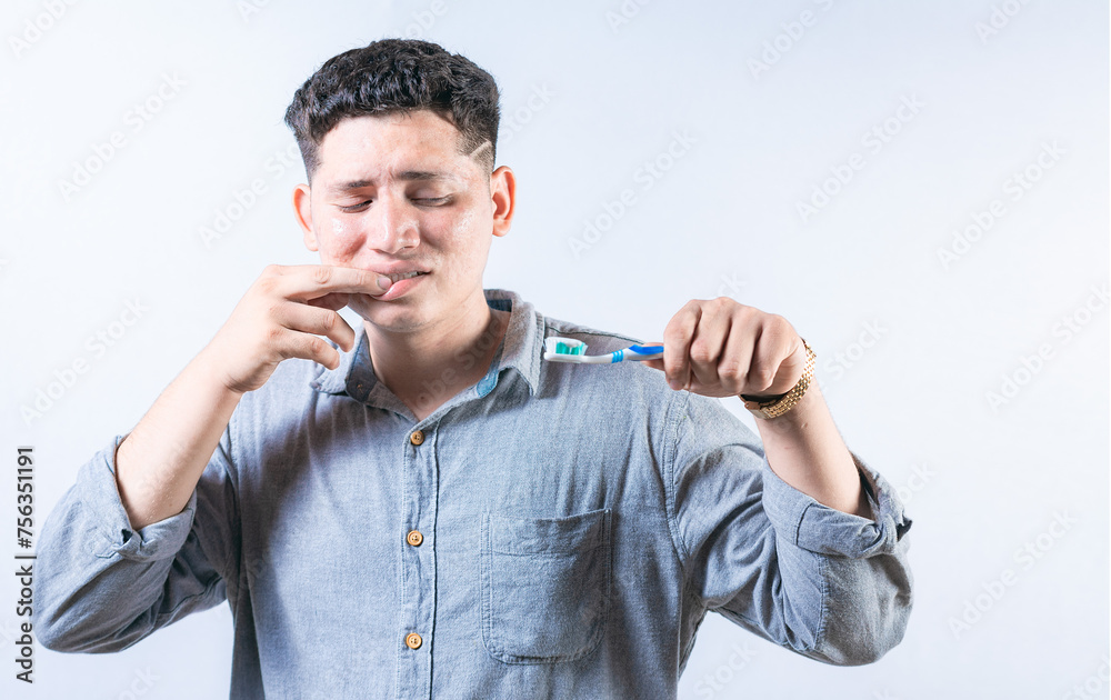 Person with gingivitis holding toothbrush isolated. Man suffering from ...
