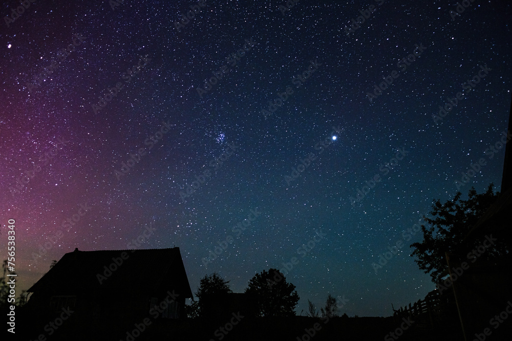 Starry sky with bright stars outside the city in the mountains, no one ...