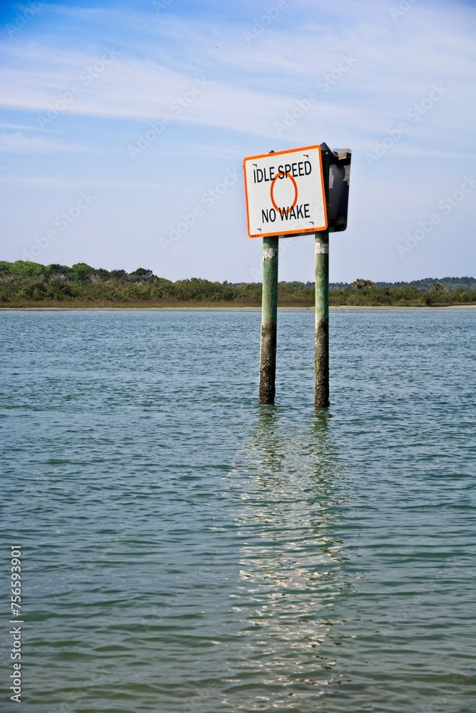 ‘Idle Speed, No Wake’ sign in boating channel Stock Photo | Adobe Stock