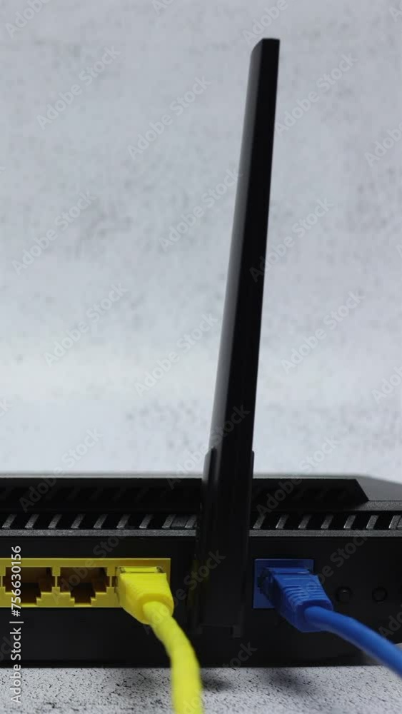 Wireless WIFI Router With Blue Patch Cord In WAN Connector And Yellow ...