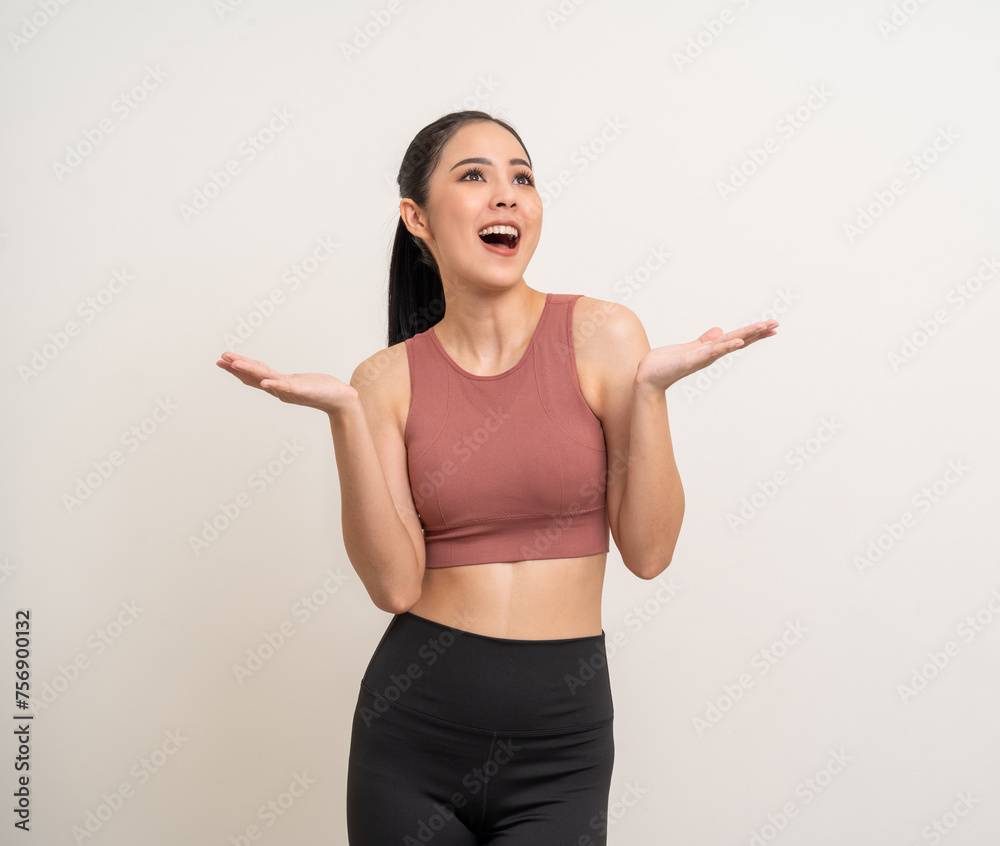 Young beautiful smiling asian woman with sportswear hand palm up with ...