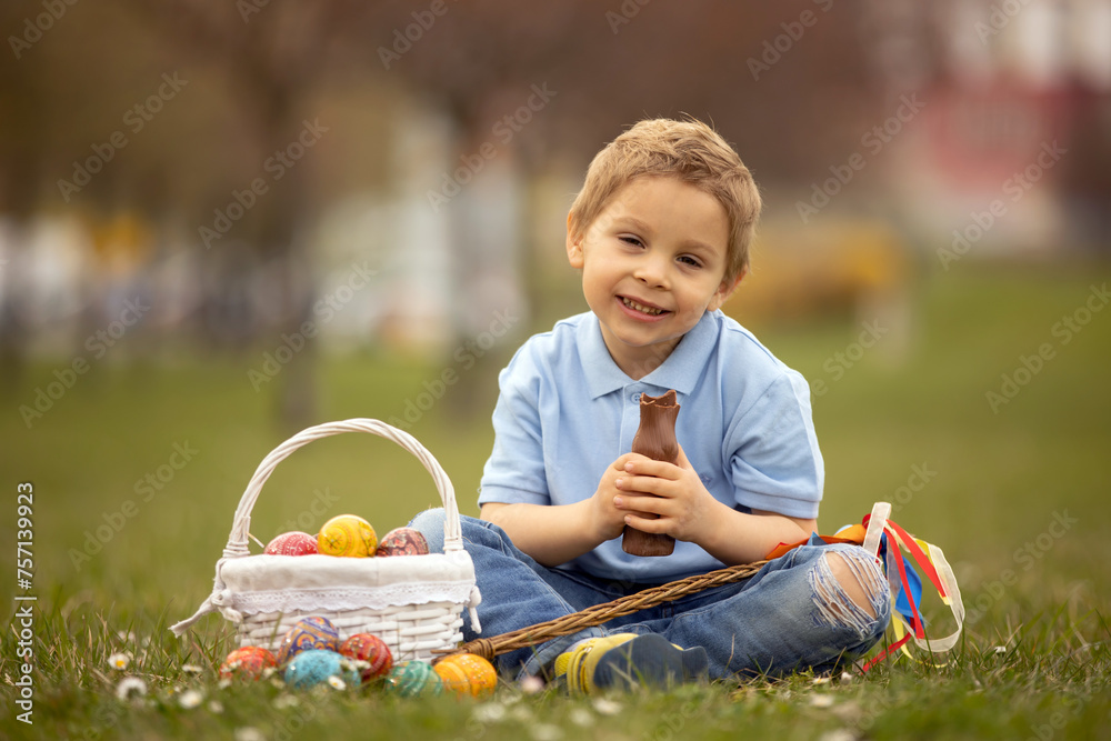 Cute preschool child, whipping his sister on Easter with twig, braided ...