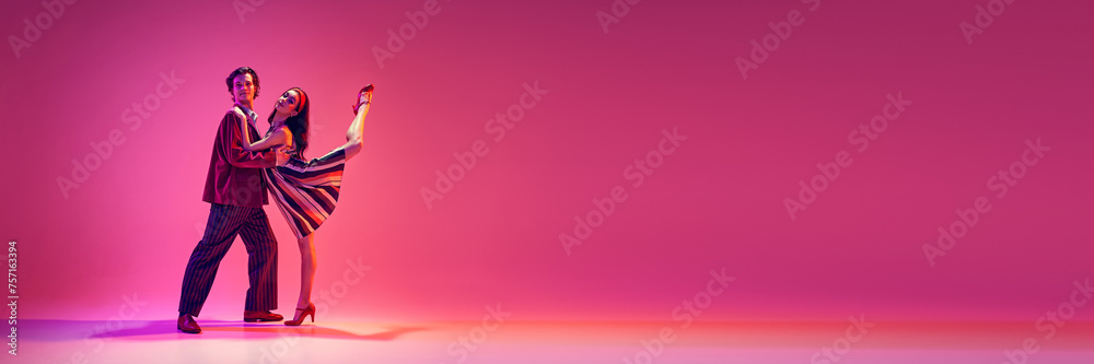 Retro dance aesthetics. Elegant young man and woman dancing against ...