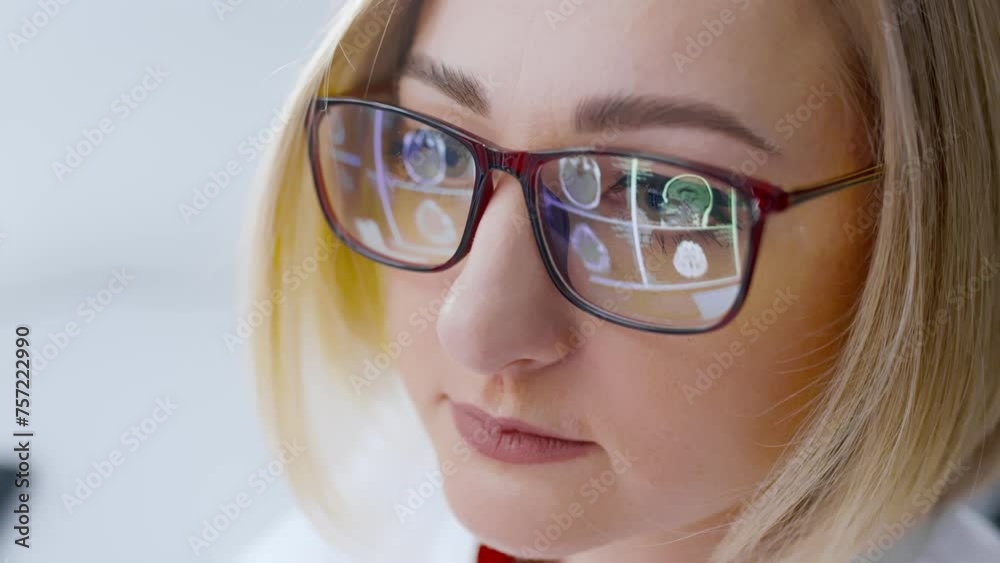 Close-up of glasses and reflection of MRI scan panorama. Close-up of a ...