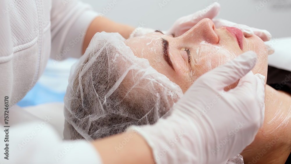 Side view portrait of young attractive woman on procedure for ...