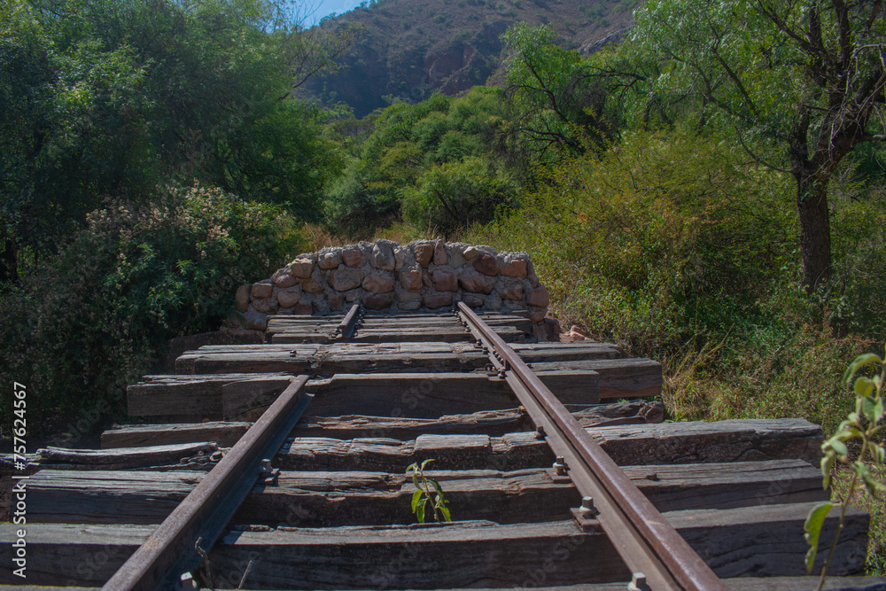 concrete buffer stop sign that ends railroad tracks boundary concept ...