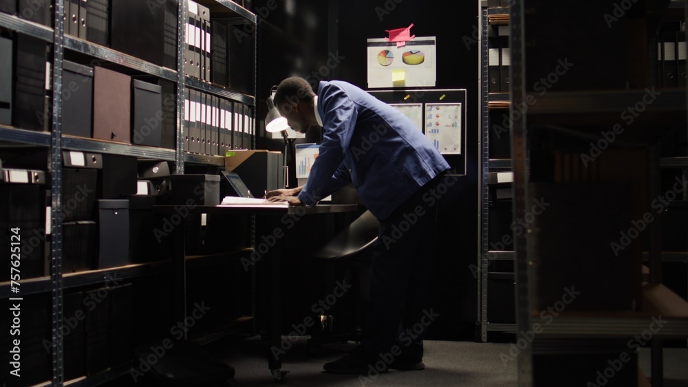 Male inspector collecting clues, analyzing statements, and utilising ...